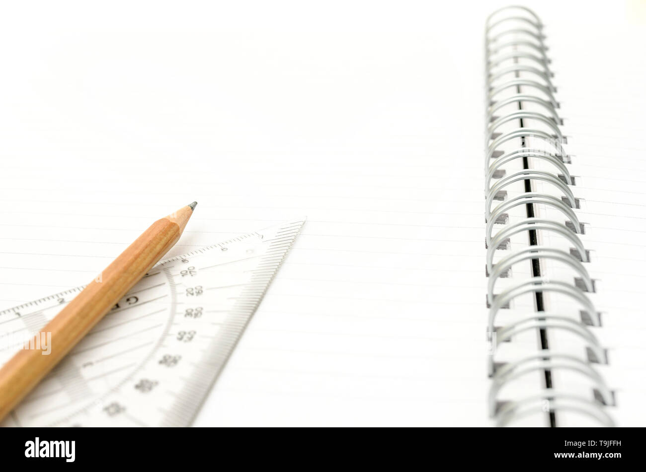 Pencil and ruler on open spiral book. Education concept Stock Photo - Alamy