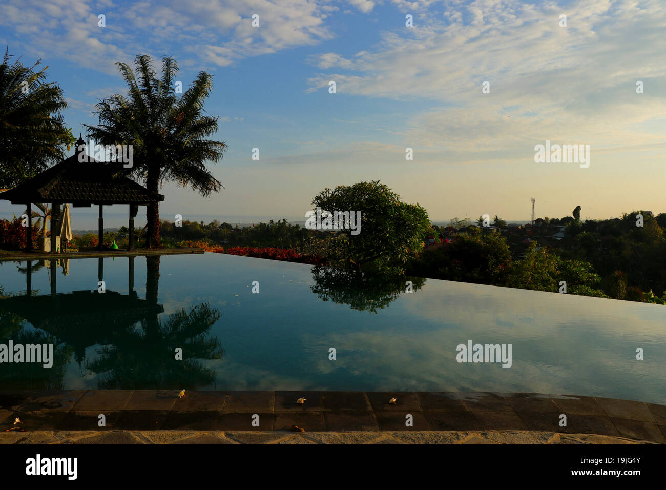 Sunrise at infinity pool with pool bar and sky reflection good to chill ...