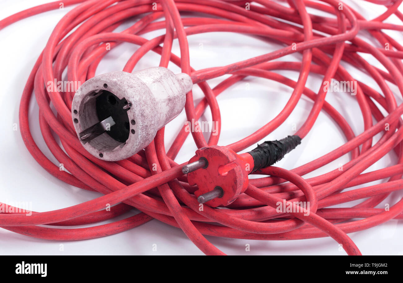 Extension cord, old and probably not safe anymore - Isolated on white ...