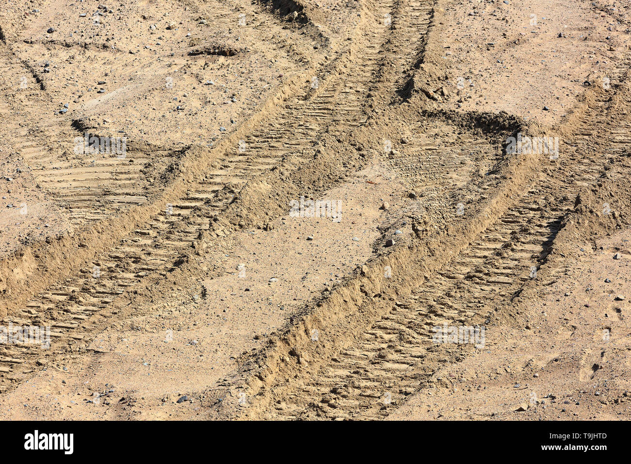 Traces of tire treads on a dry soil surface Stock Photo - Alamy