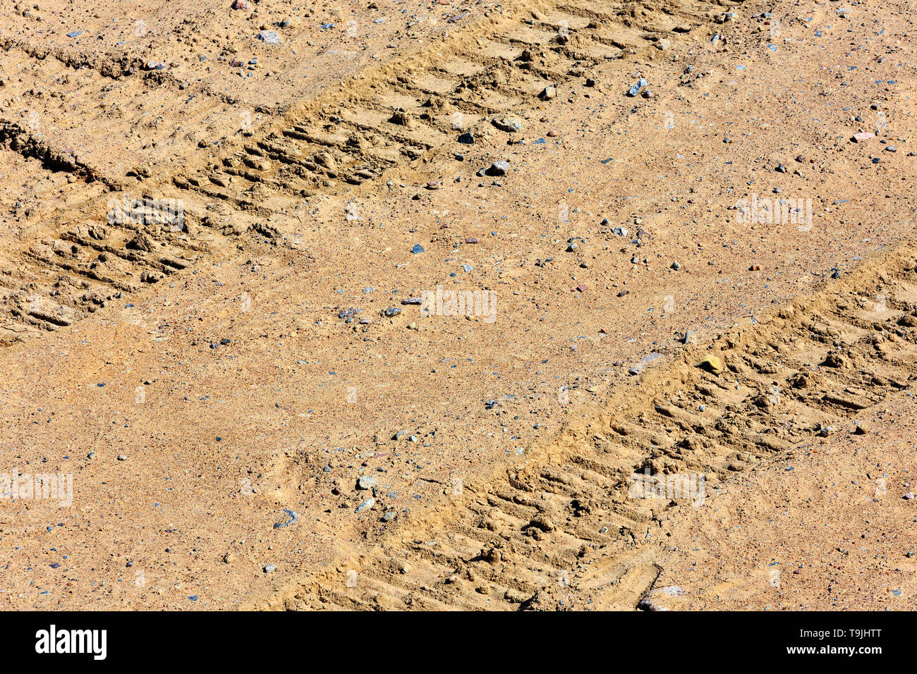 Traces of tire treads on a dry soil surface Stock Photo - Alamy