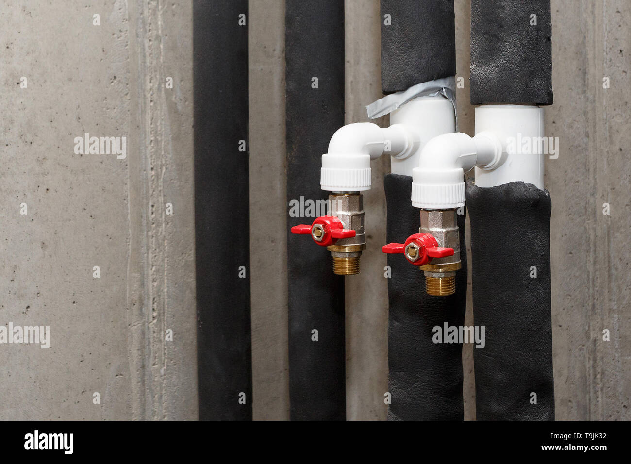 Sanitary cranes for further distribution of cold water Stock Photo - Alamy