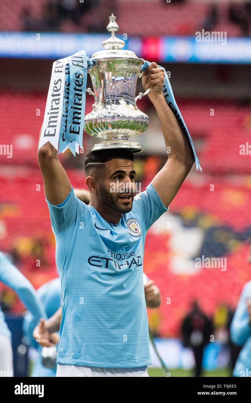 LONDON, ENGLAND - MAY 18: Riyad Mahrez of Manchester City lifts the ...