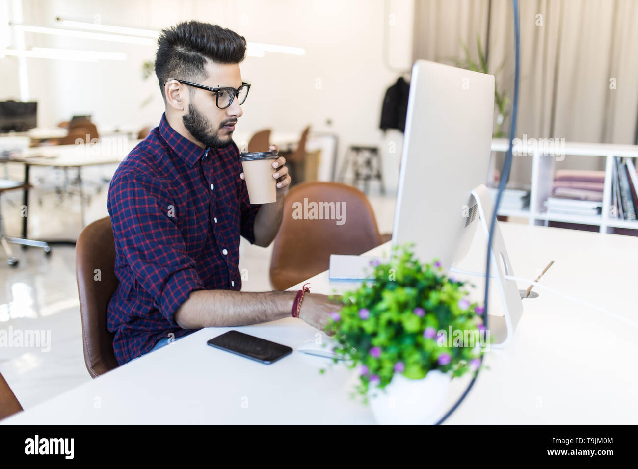 Pakistani man working office hi-res stock photography and images - Alamy