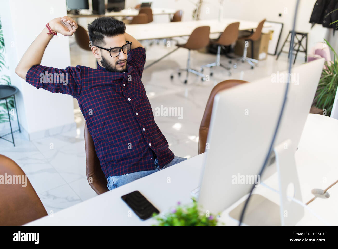 Business men relaxing from work in the office Stock Photo - Alamy