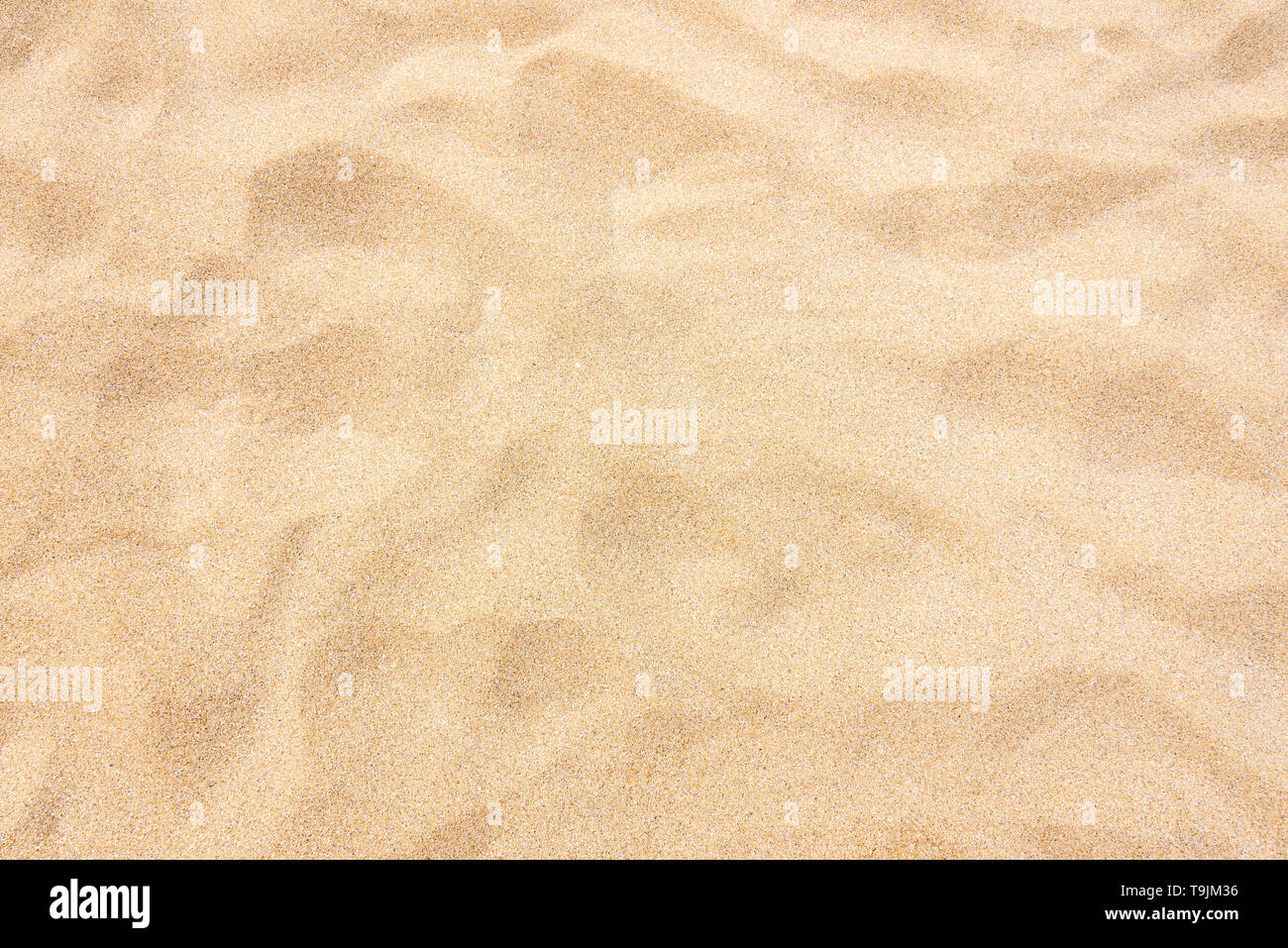Yellow beach sand background Stock Photo - Alamy