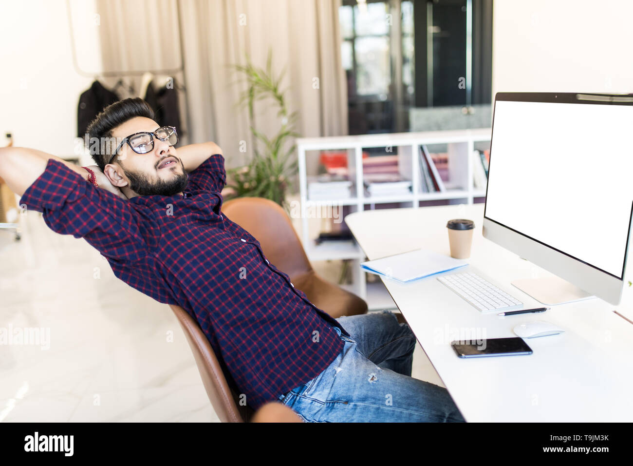 Business men relaxing from work in the office Stock Photo - Alamy