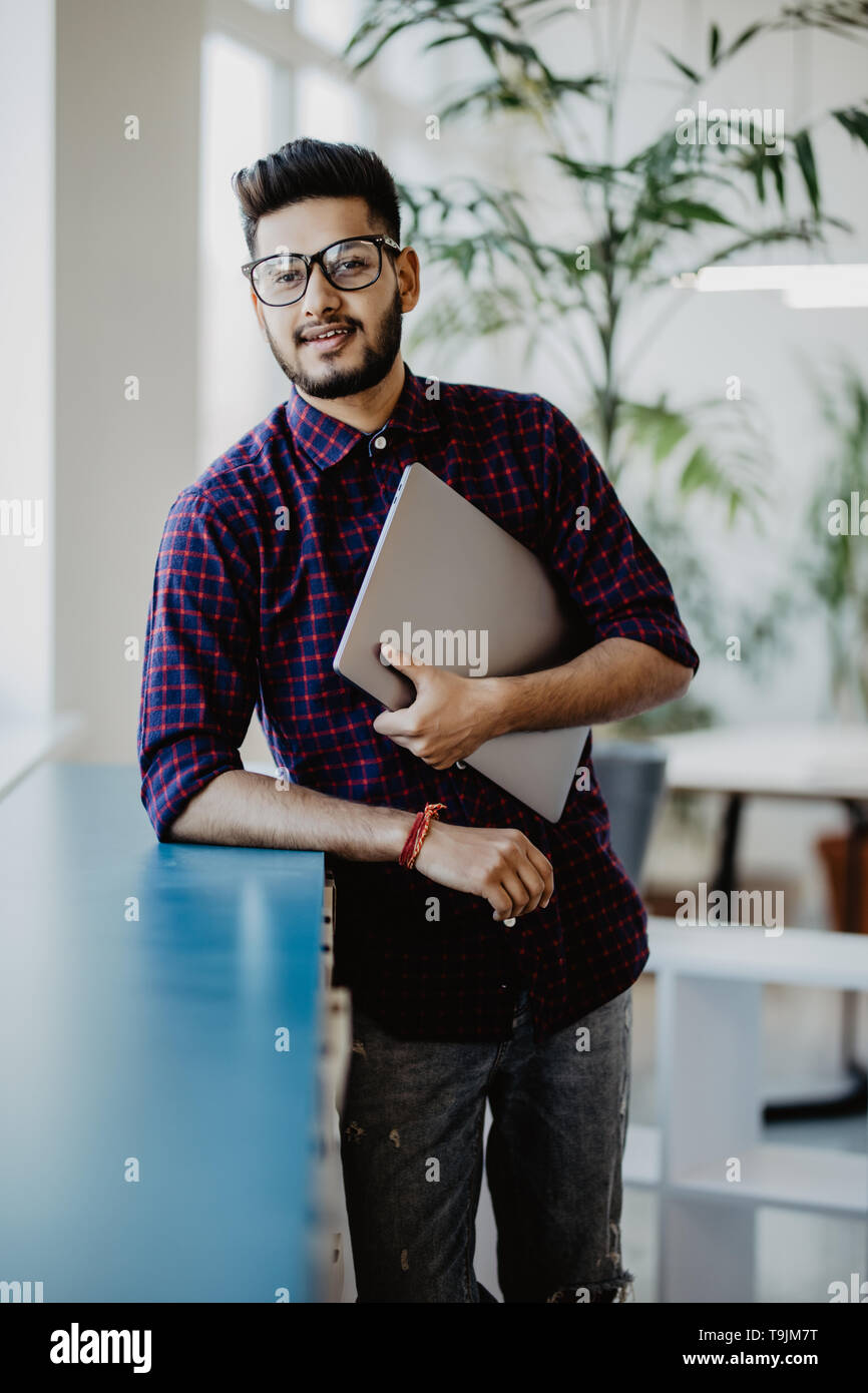 Confident businessman working on his computer in the office Stock Photo ...