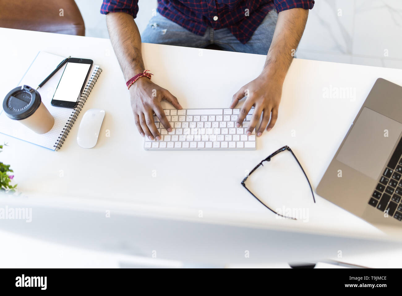 Overhead View Of Businessman Working At Computer In Office Stock Photo ...
