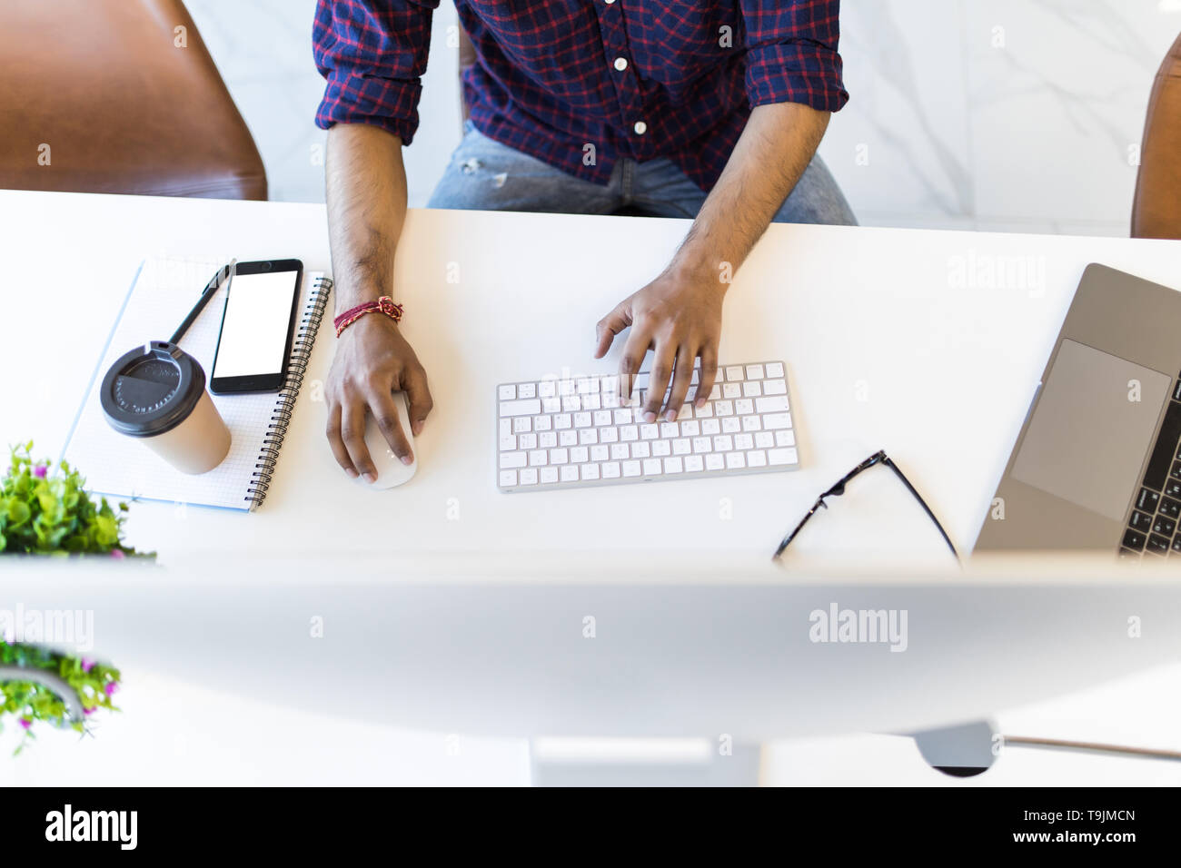 Overhead View Of Businessman Working At Computer In Office Stock Photo ...