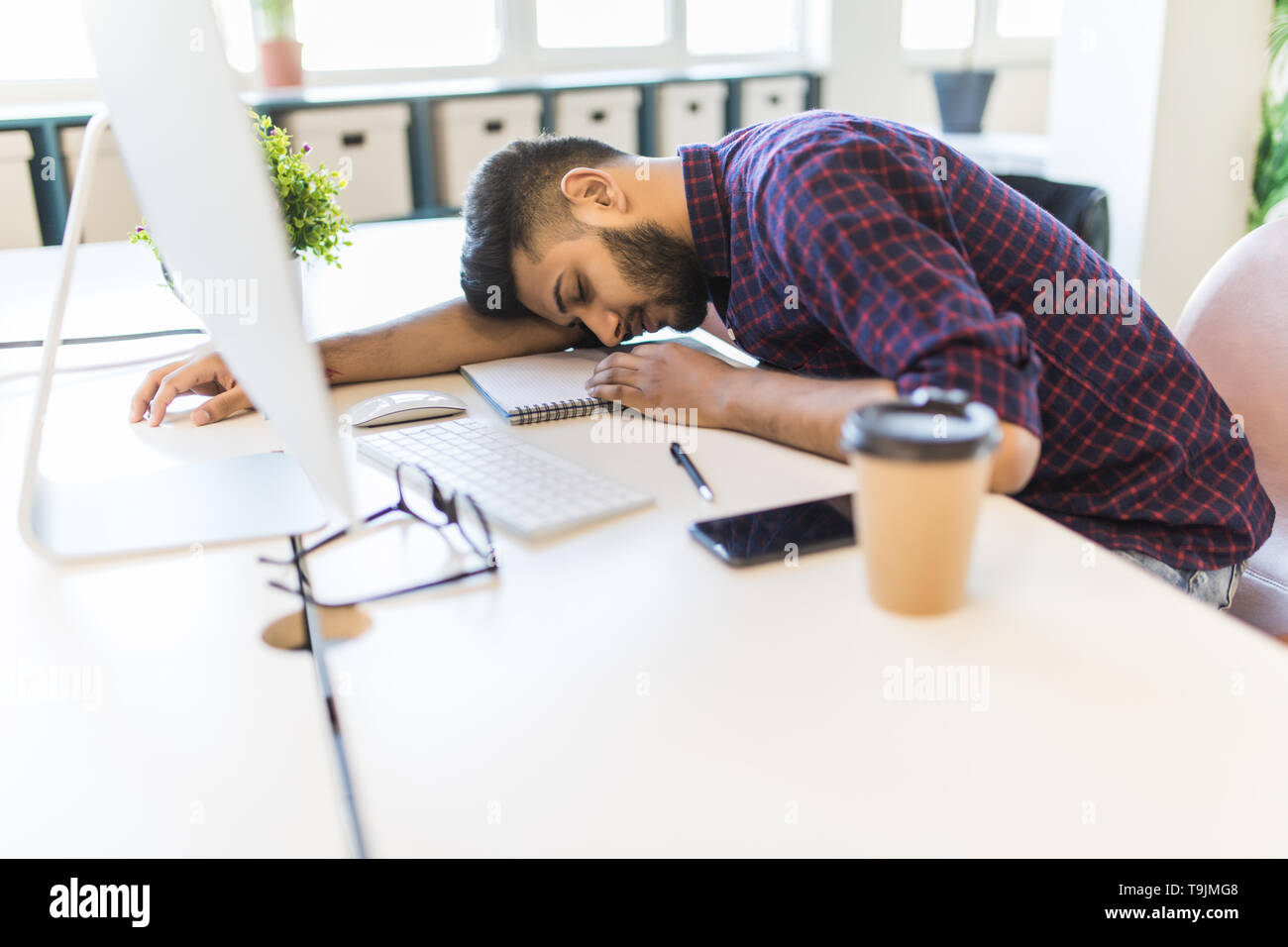 Office man sleeping while working on the computer Stock Photo - Alamy