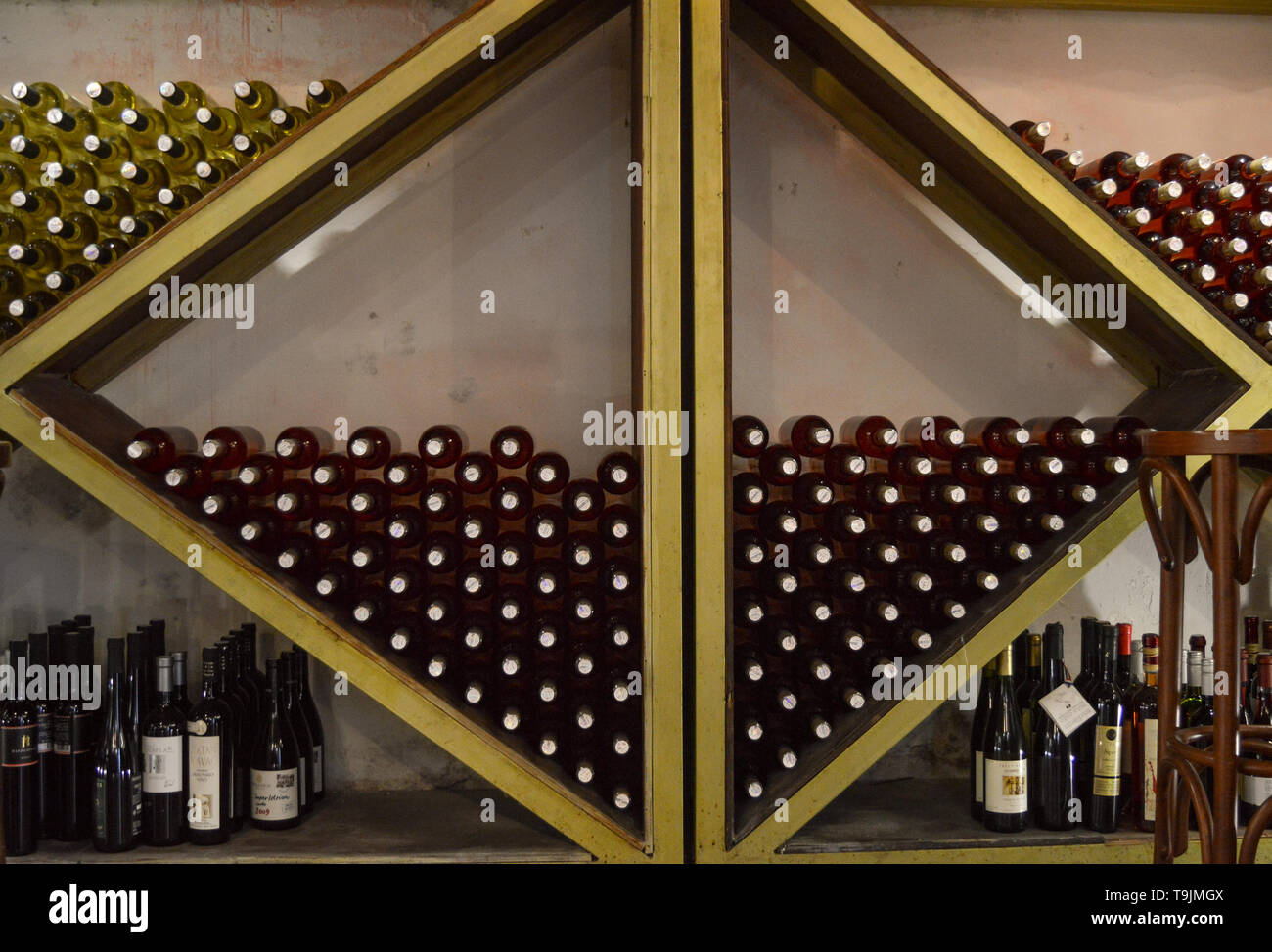 Wine cellar with red and white wine bottles Stock Photo - Alamy