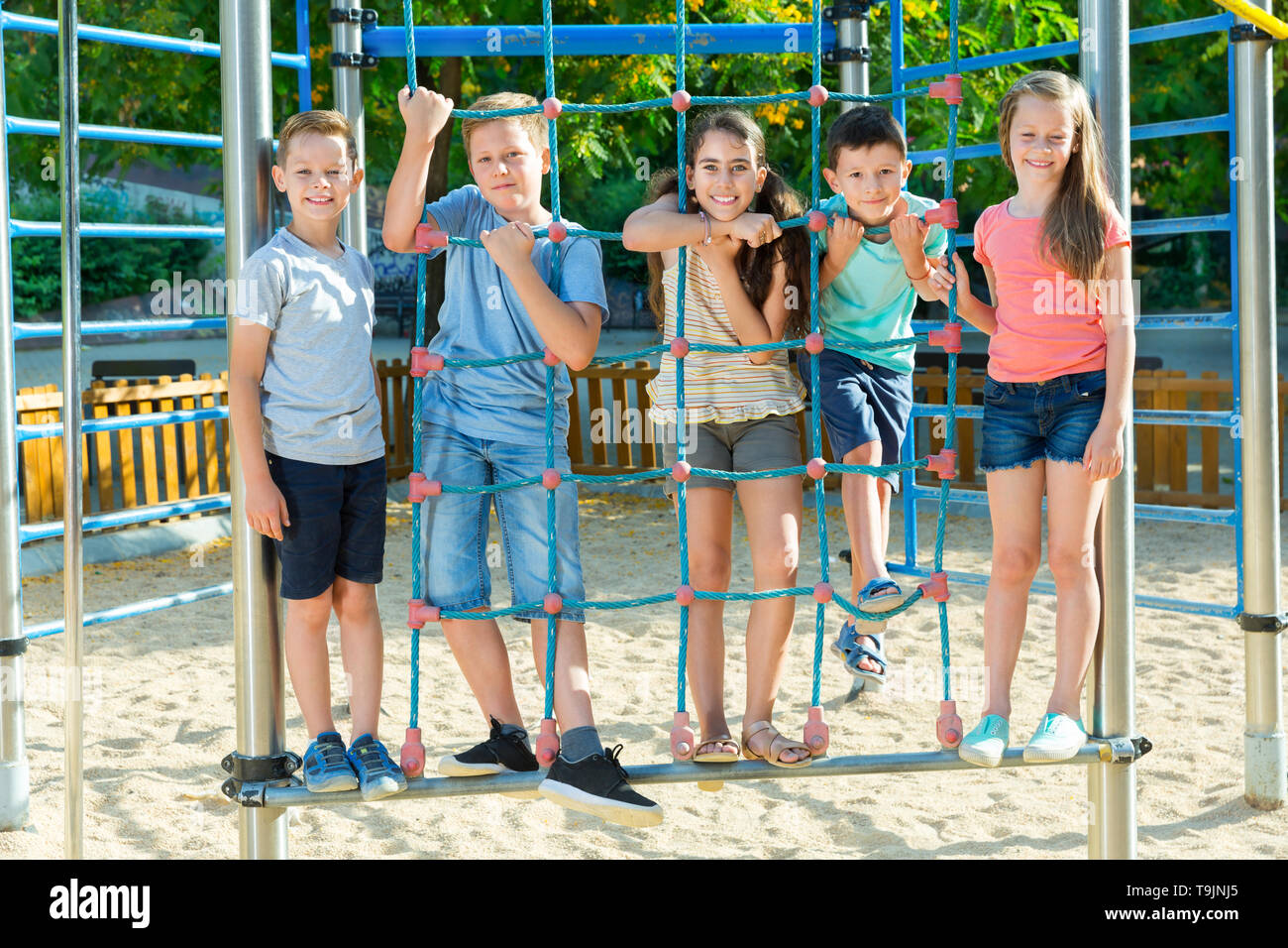 Portrait of children playing at the playground Stock Photo - Alamy