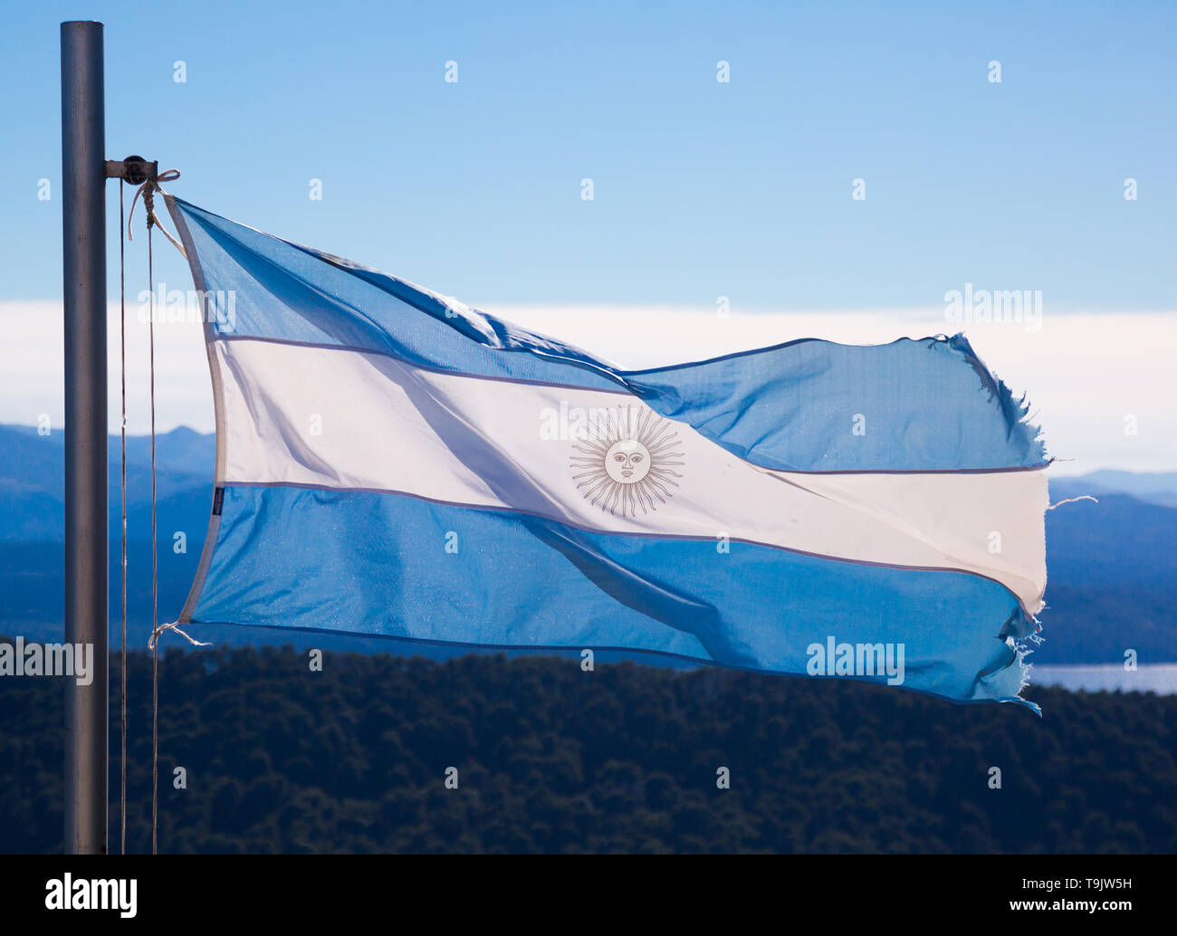 Blue and white flag of Argentina with May sun on white strip. Argentina ...
