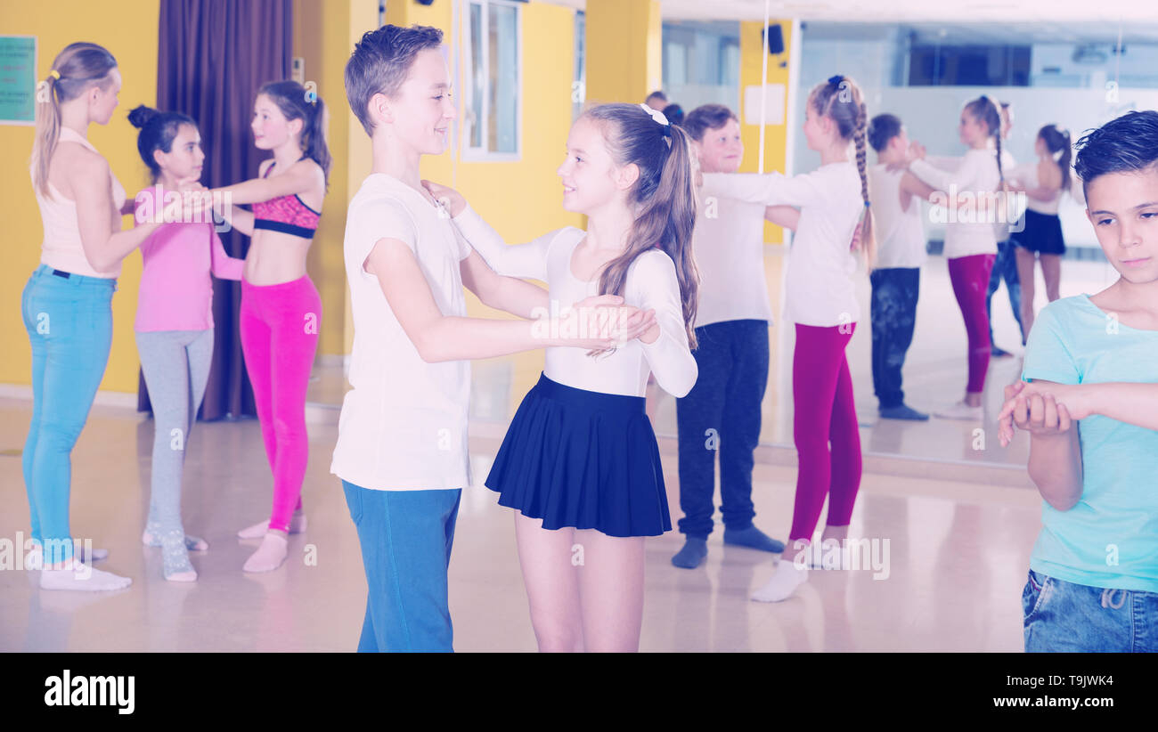 Children dancing together slow ballroom dances in pairs in choreography ...