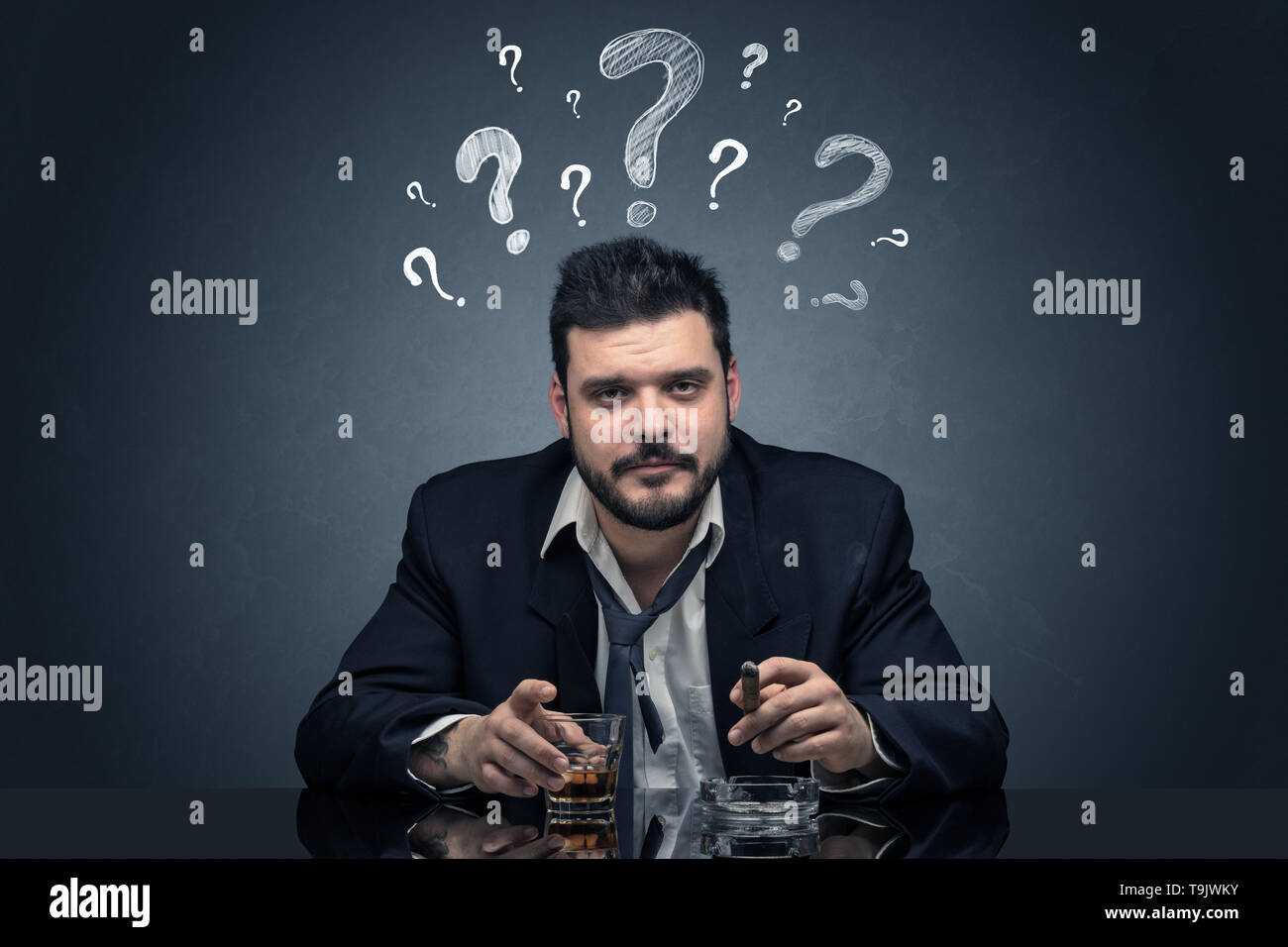 Young drunk disappointed man with question signs concept Stock Photo ...