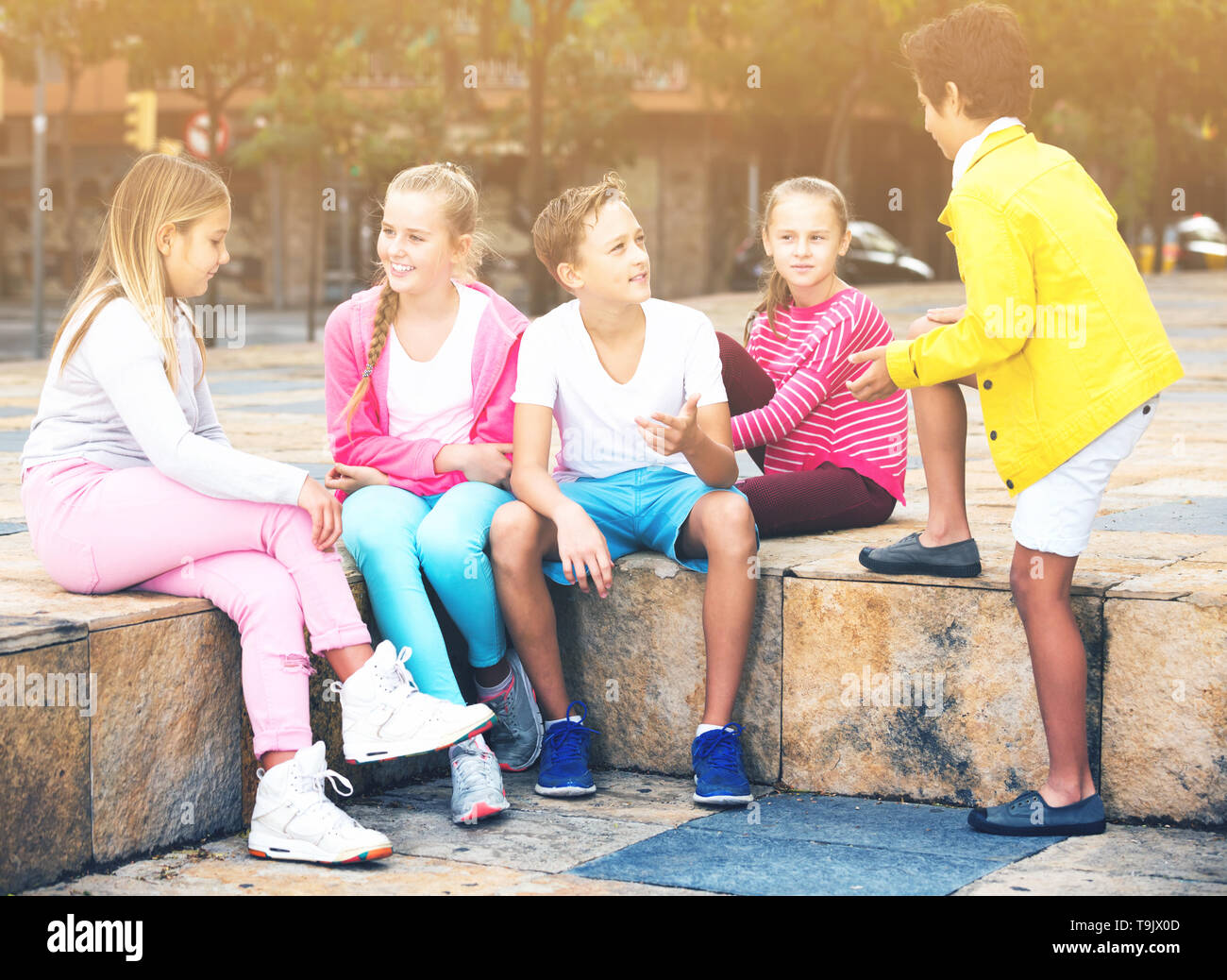 Five children are talking about play on walk outdoors Stock Photo - Alamy