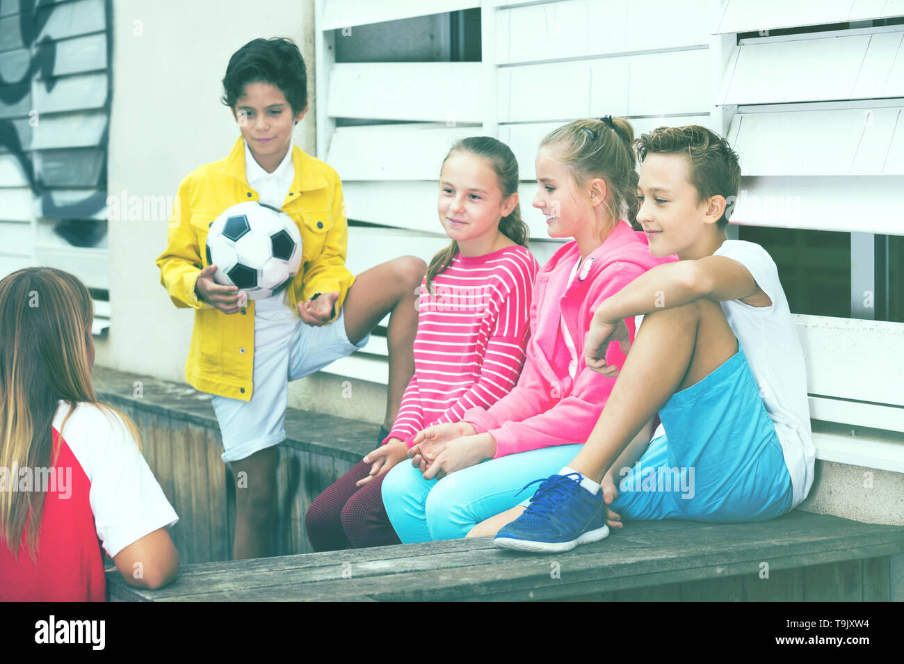 Company of five children talking about play on walk outdoors Stock ...
