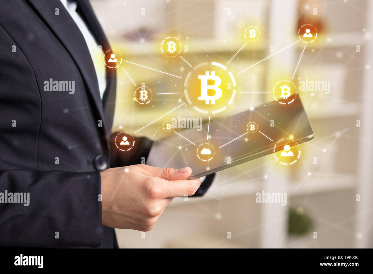 Business woman using tablet with cryptocurrency bitcoin link network ...