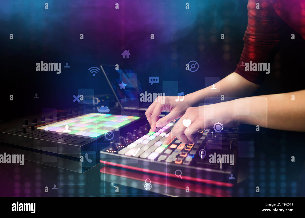 Hand mixing music on dj controller with social media concept icons ...
