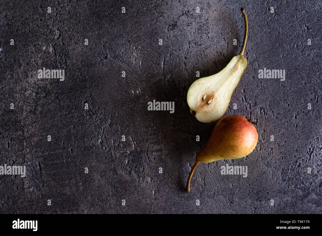 Organic Pear on Rustic Dark Background with Copy Space. Health Benefits ...