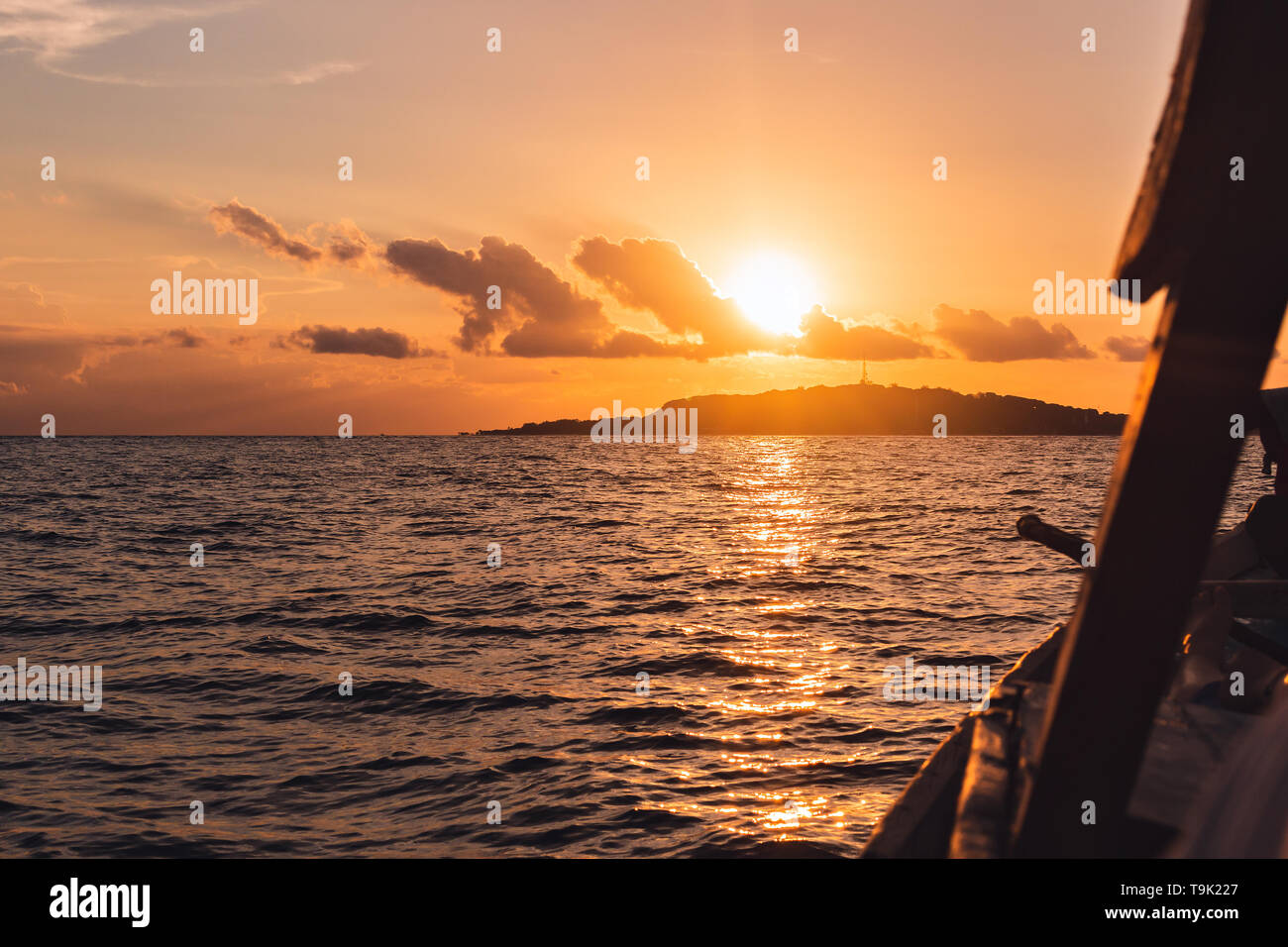 Sunset at the sea, dramatic sky, indonesia Stock Photo - Alamy