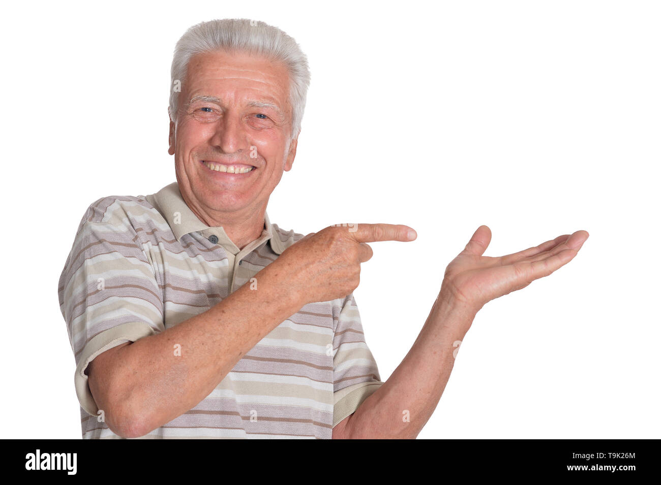 Portrait of senior man showing something on white background Stock ...