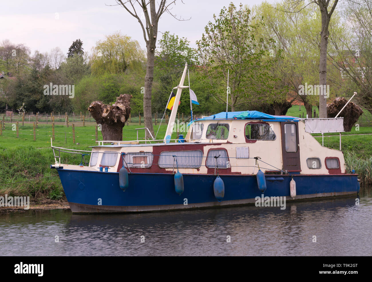Old boat floating on the water to be restored Stock Photo - Alamy