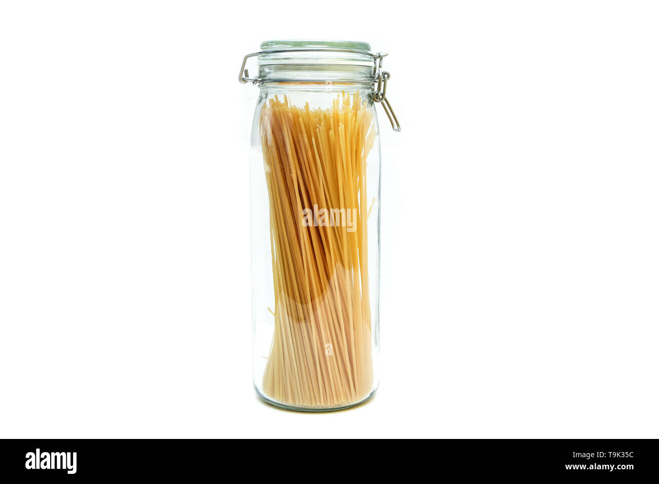The spaghetti pasta stored inside the closable glass bottle isolated on ...