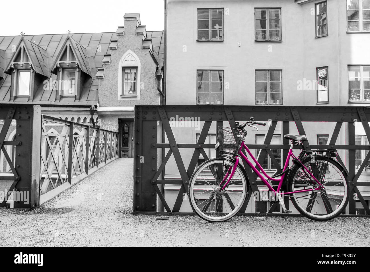 A picture of a lonely violet bike standing in the typical street in ...