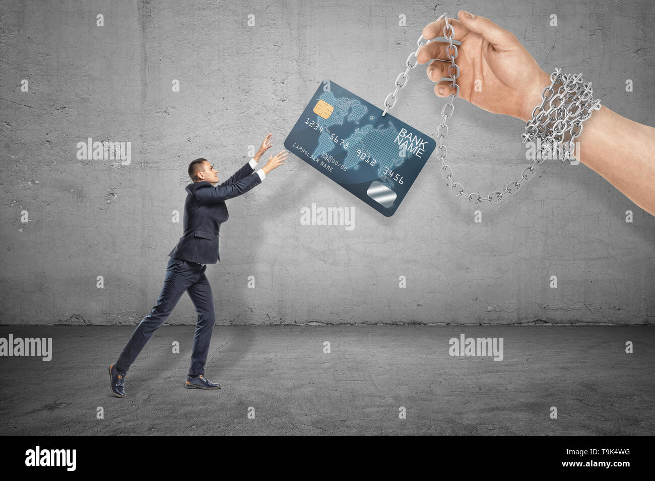 Side full length view of little businessman reaching out to grab credit ...