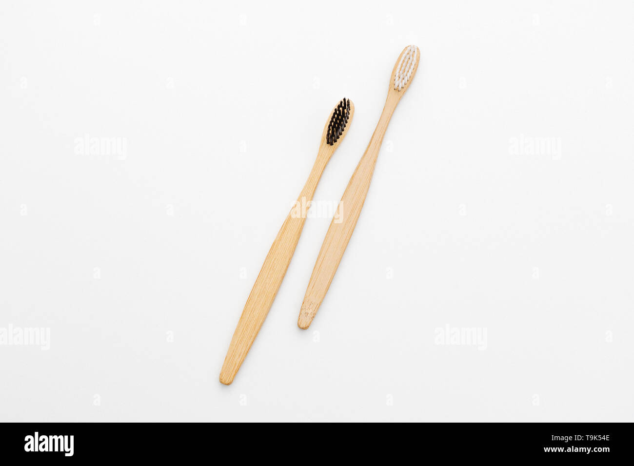 Wooden toothbrushes for the care of teeth on white background. Concept ...