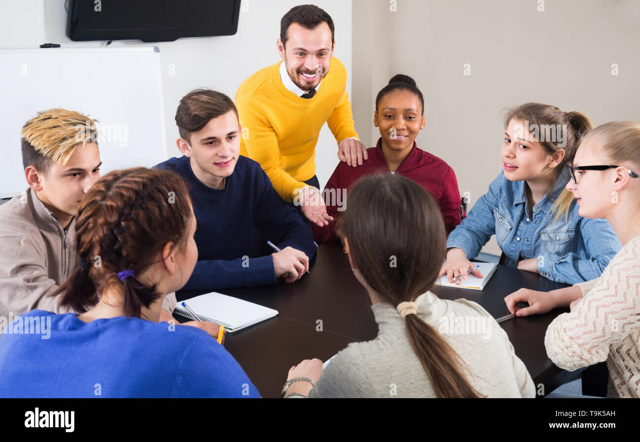 concentrated classmates having difficult project to complete during ...