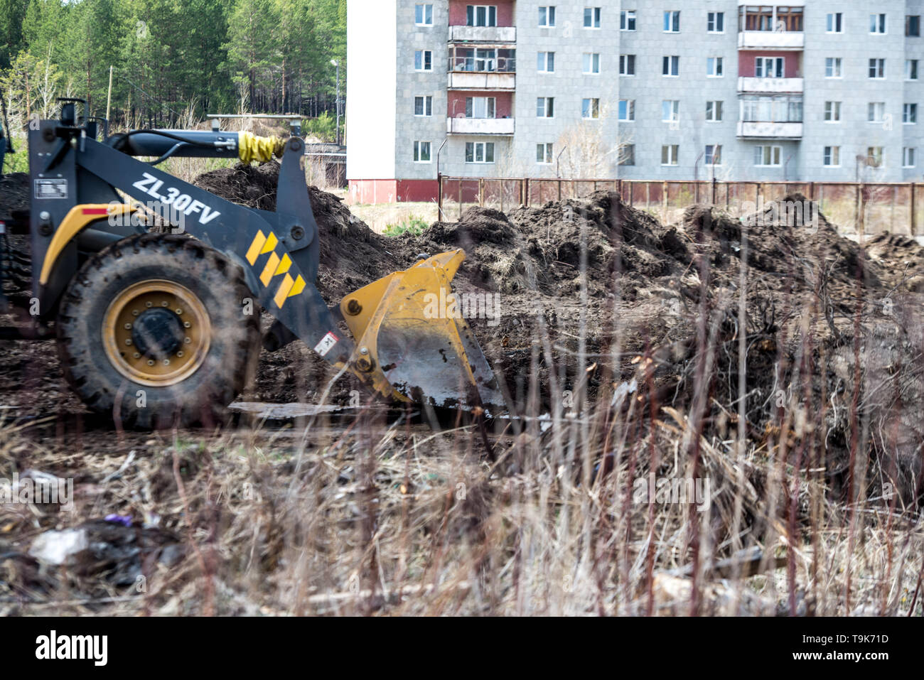 Chelyabinsk region, Russia - May 2019: bulldozer pushes the ground ...