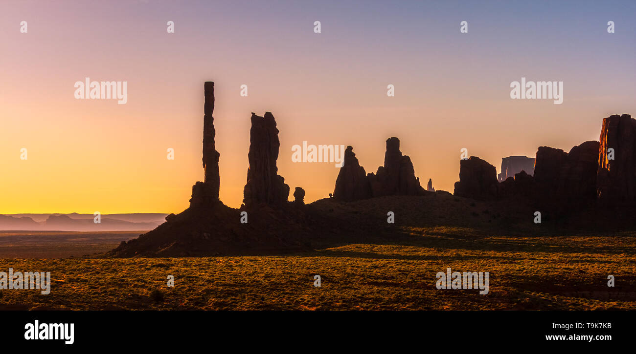 Monument Valley scenery at sunrise. Totem Pole and Yei Bi Chei rocky ...