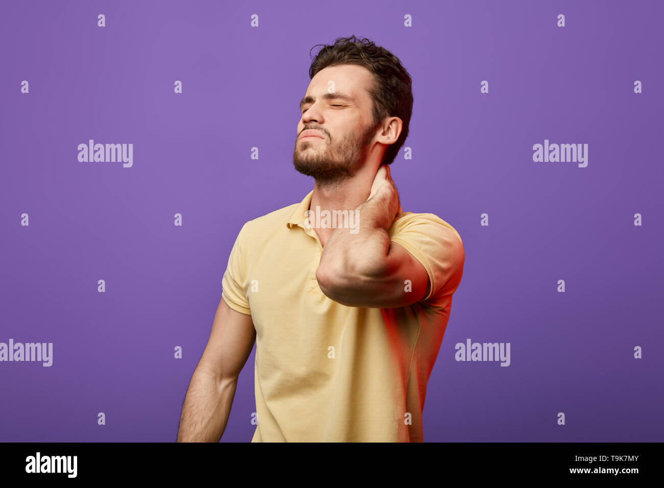 sick man with closed eyes holding his neck, guy with muscle injury ...