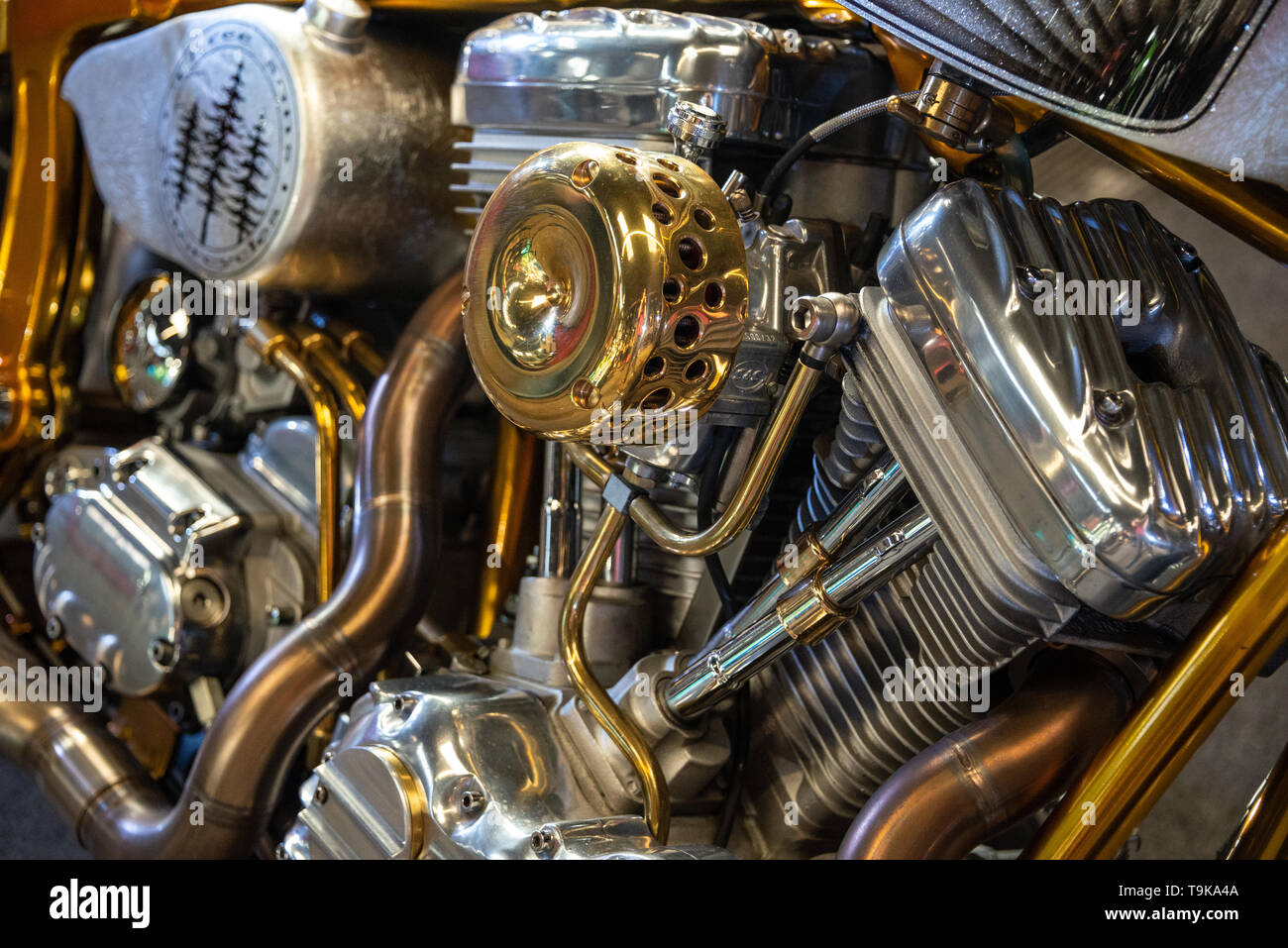 Detail of the motor of v engine of a chrome motorcycle in silver and ...