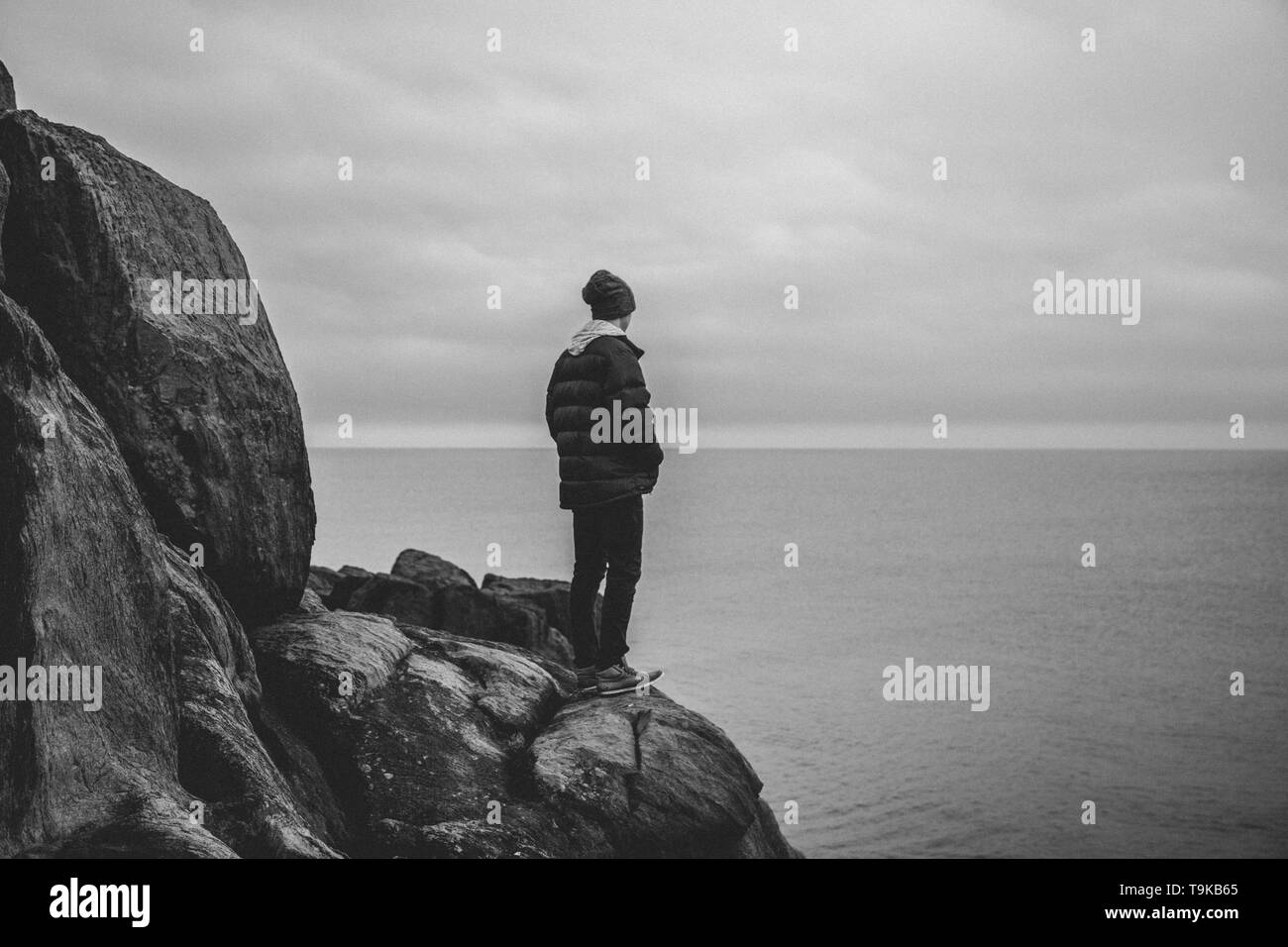 Man on sea beach sunrise Black and White Stock Photos & Images - Alamy