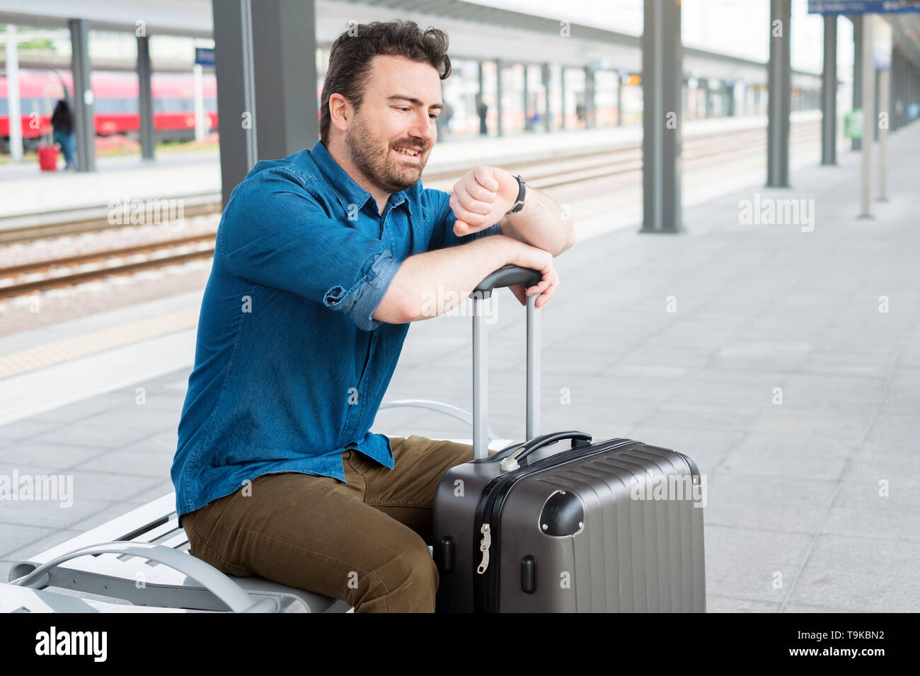Man train station bench hi-res stock photography and images - Alamy