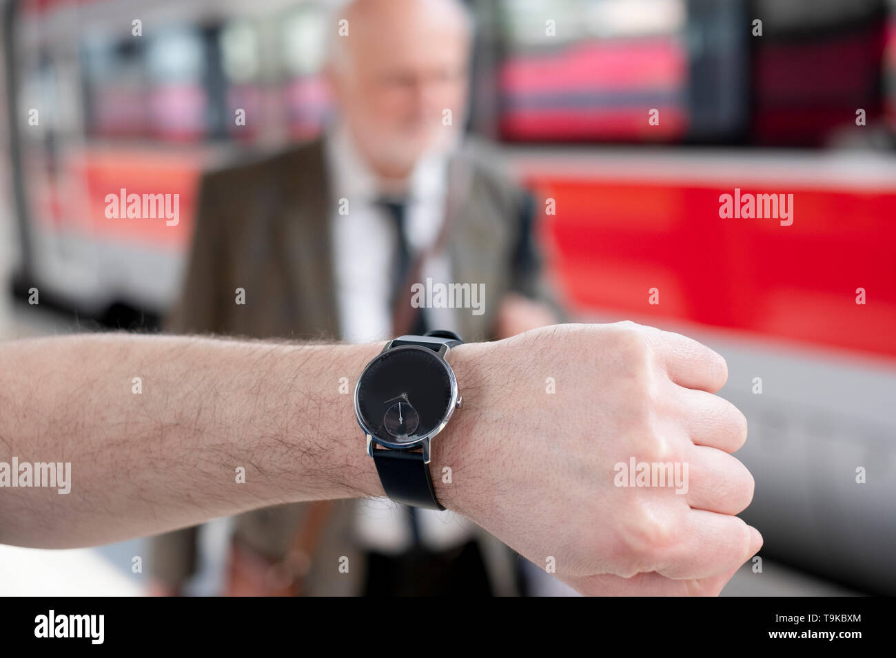 Man looking schedule train station hi-res stock photography and images ...