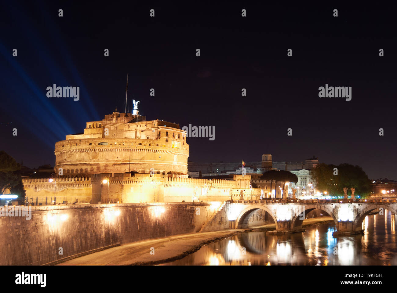 A night wiew of Holy Angel Castle in Rome with the reflection of the building over the Tiber ...