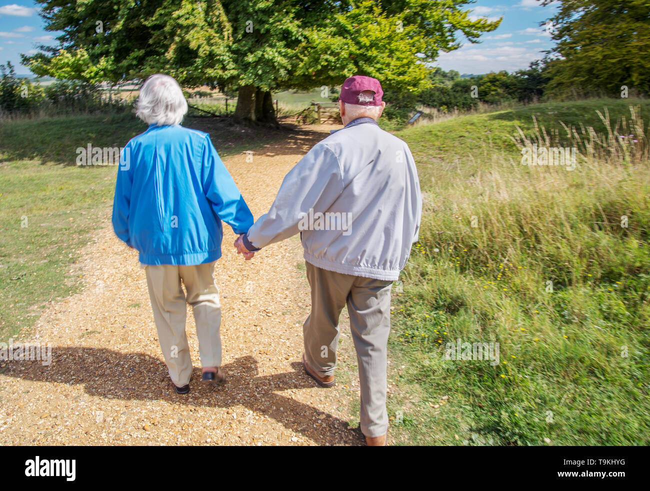 Older couple walking away hi-res stock photography and images - Alamy