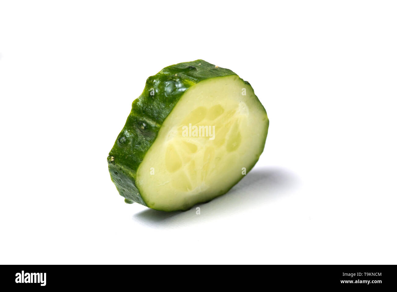 Closeup of green fresh one piece of cucumber on white isolated ...