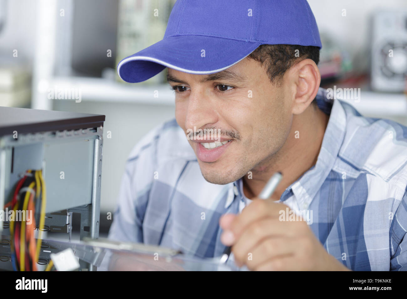 computer engineer working on broken console Stock Photo - Alamy