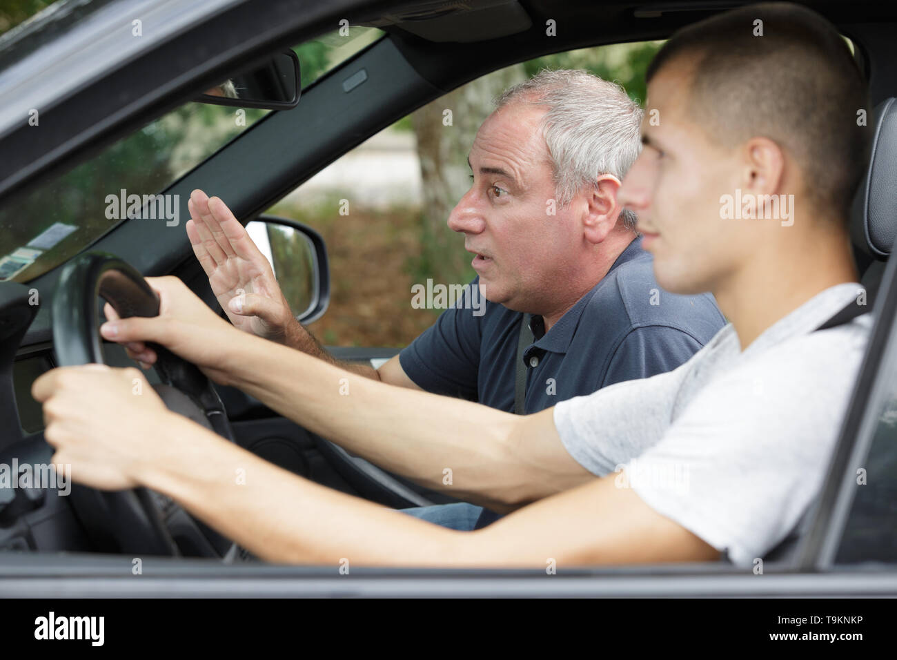 driving test teacher giving instructions to student Stock Photo - Alamy