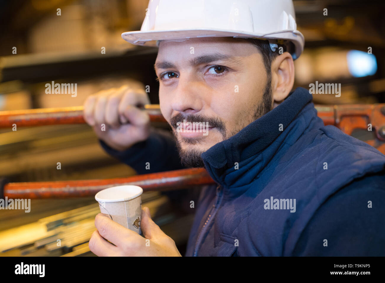 warehouse worker having a coffee break Stock Photo - Alamy