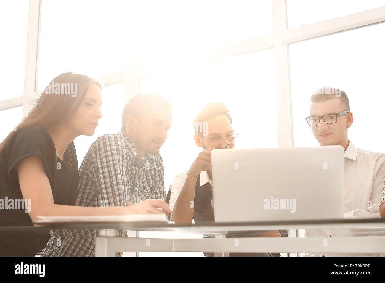 business team uses a laptop to work with documents . the concept of ...