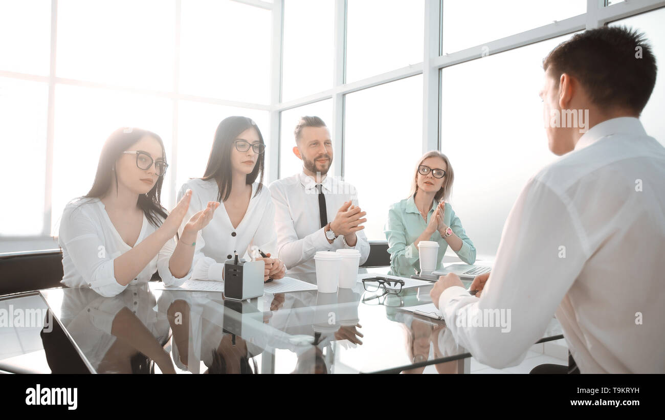 business team applauding in a meeting in the office . concept of ...