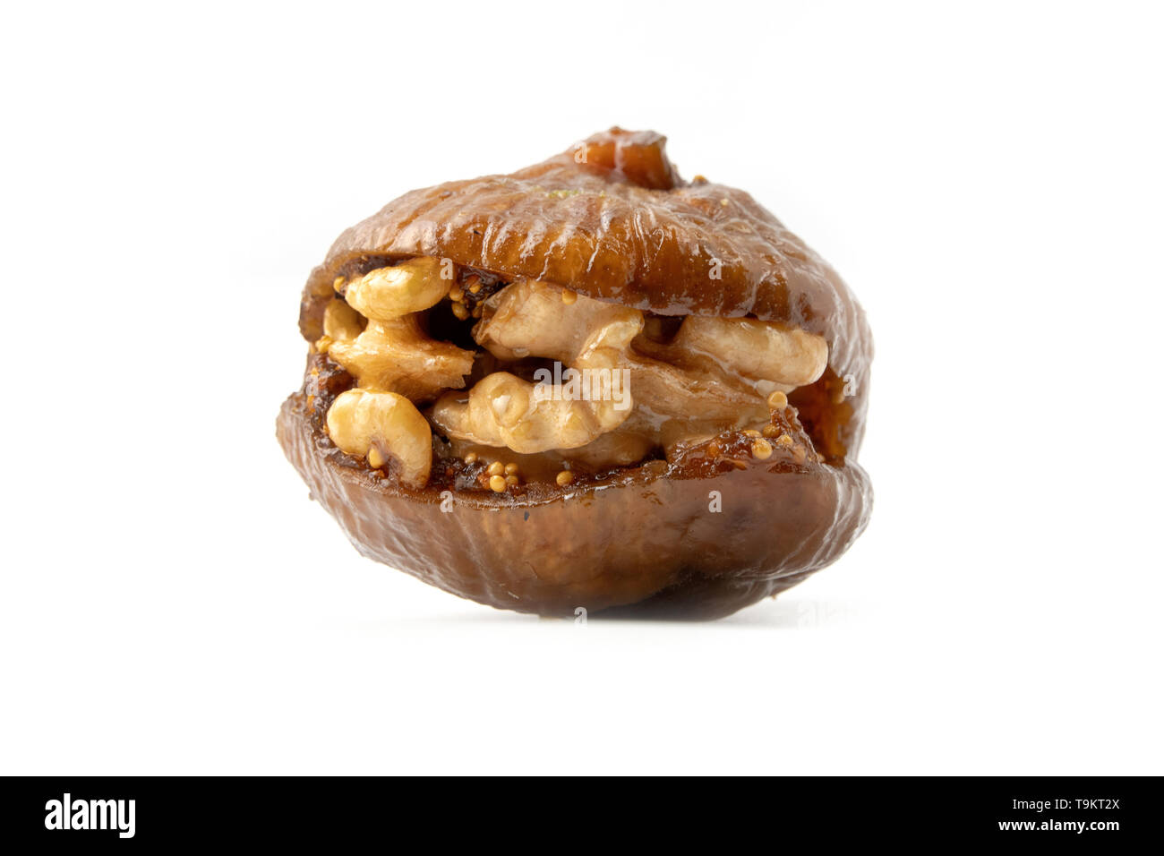 Traditional turkish walnut stuffed fig on a white background Stock ...