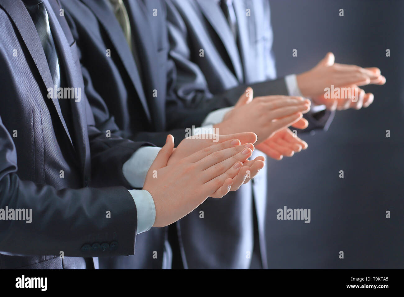 Applauding leadership smiling standing hi-res stock photography and ...